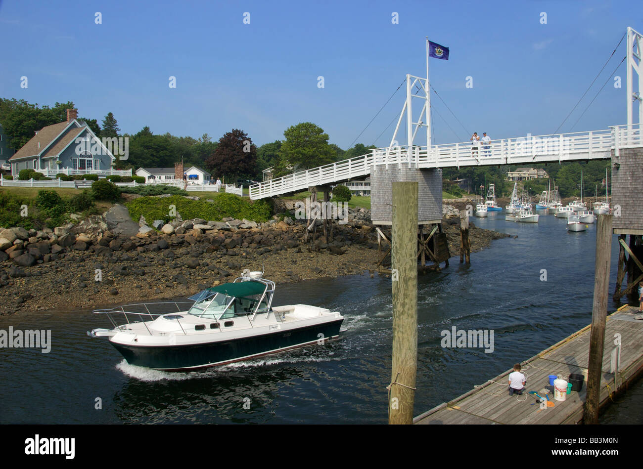 USA, New England, Maine, Ogunquit, boat going under drawbridge in ...