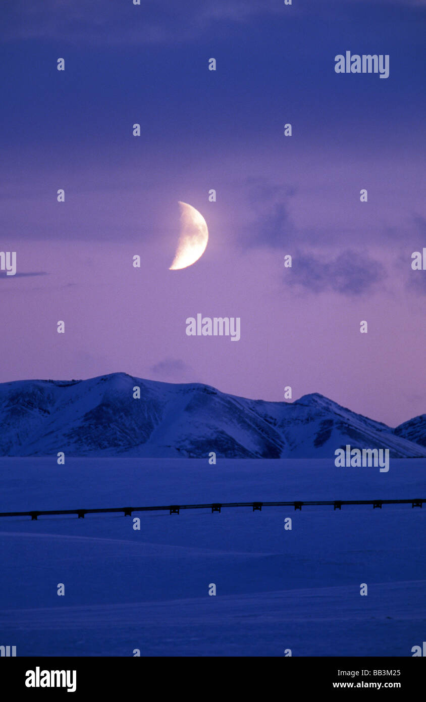 North America, USA, Alaska, Brooks Range. Moon rises over the Trans ...
