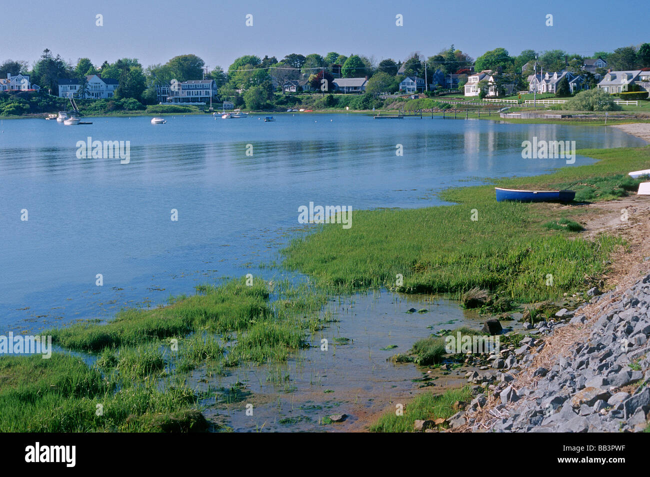 North America, USA, Massachusetts, Chatham. Houses and boats surround ...
