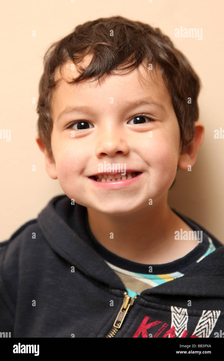 3 year old boy smiling into the camera Stock Photo - Alamy