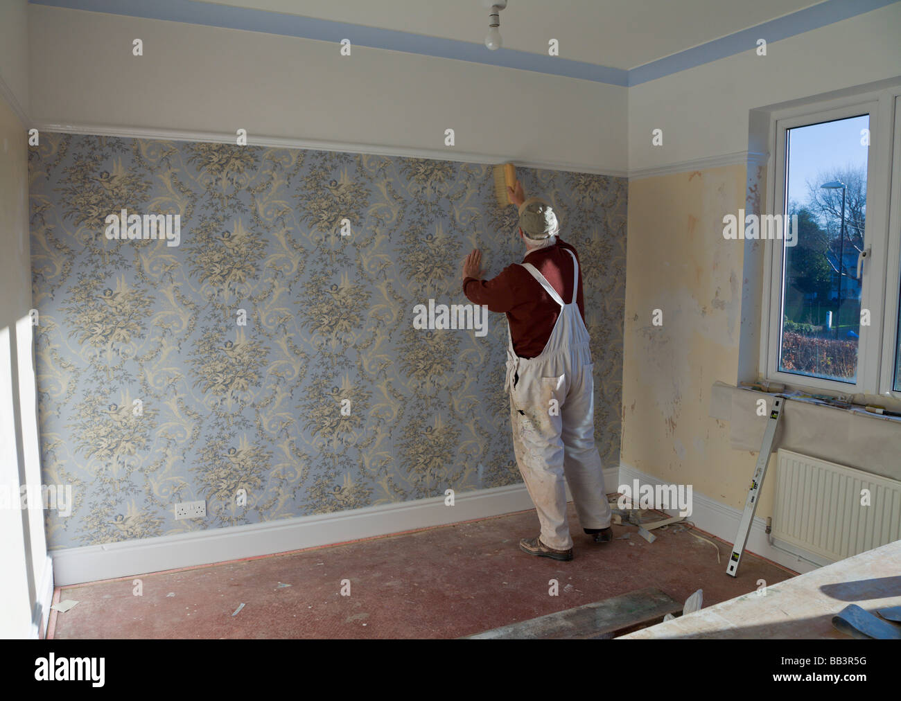 Man decorating a room Stock Photo - Alamy