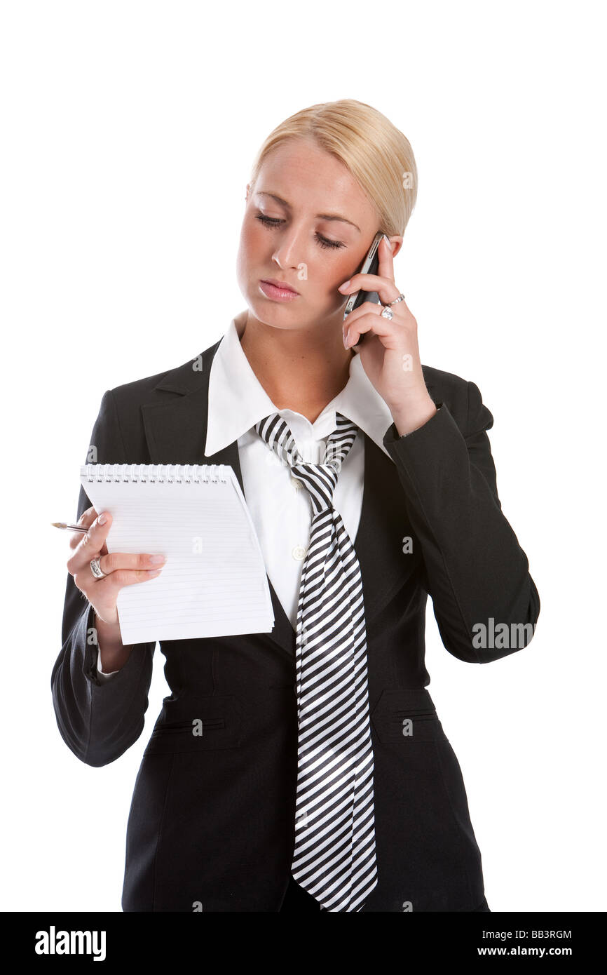 Beautiful young businesswoman checking her notes while on the phone ...