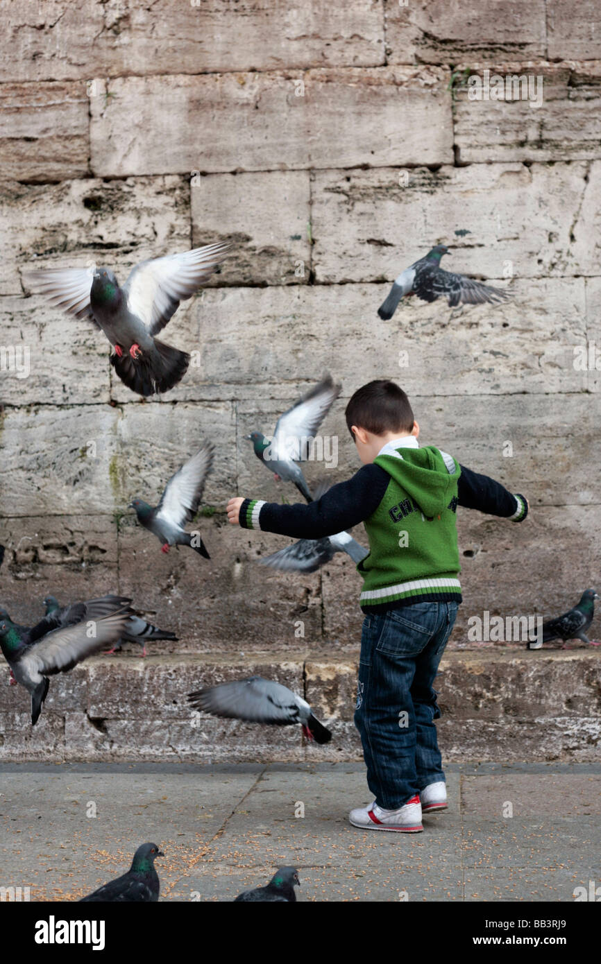 Boy Chasing Pigeons by the Yeni Camii or New Mosque in Istanbul Turkey ...