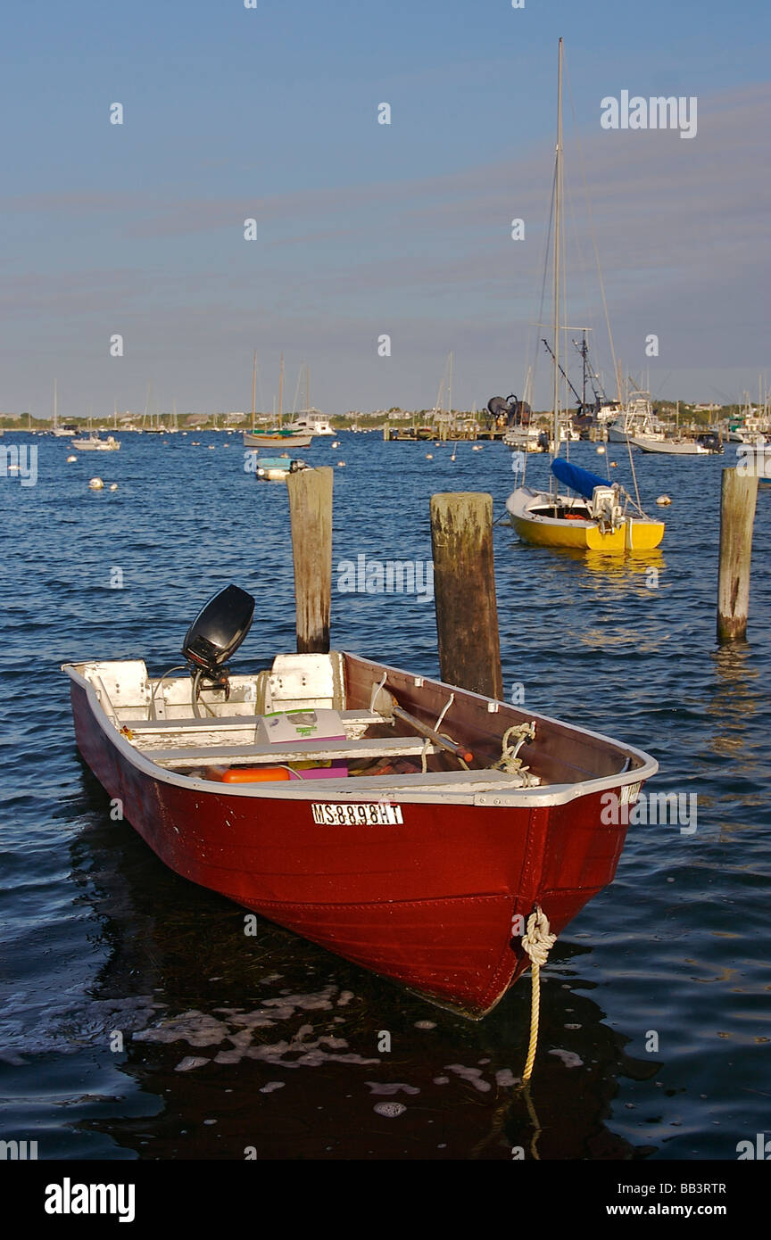 North America, USA, Massachusetts, Nantucket. A red motorboat docked in ...