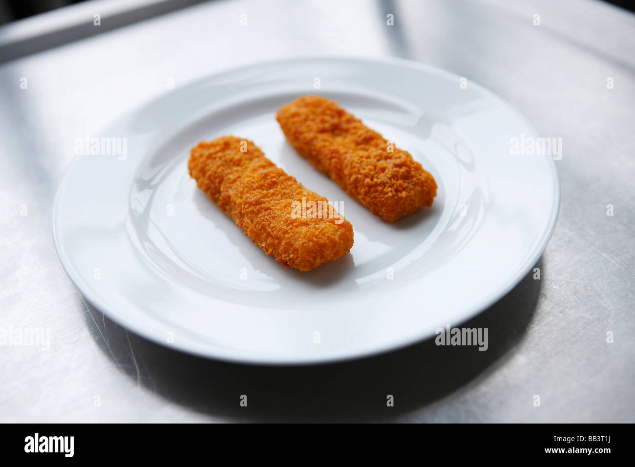 Fish fingers on plate Stock Photo - Alamy