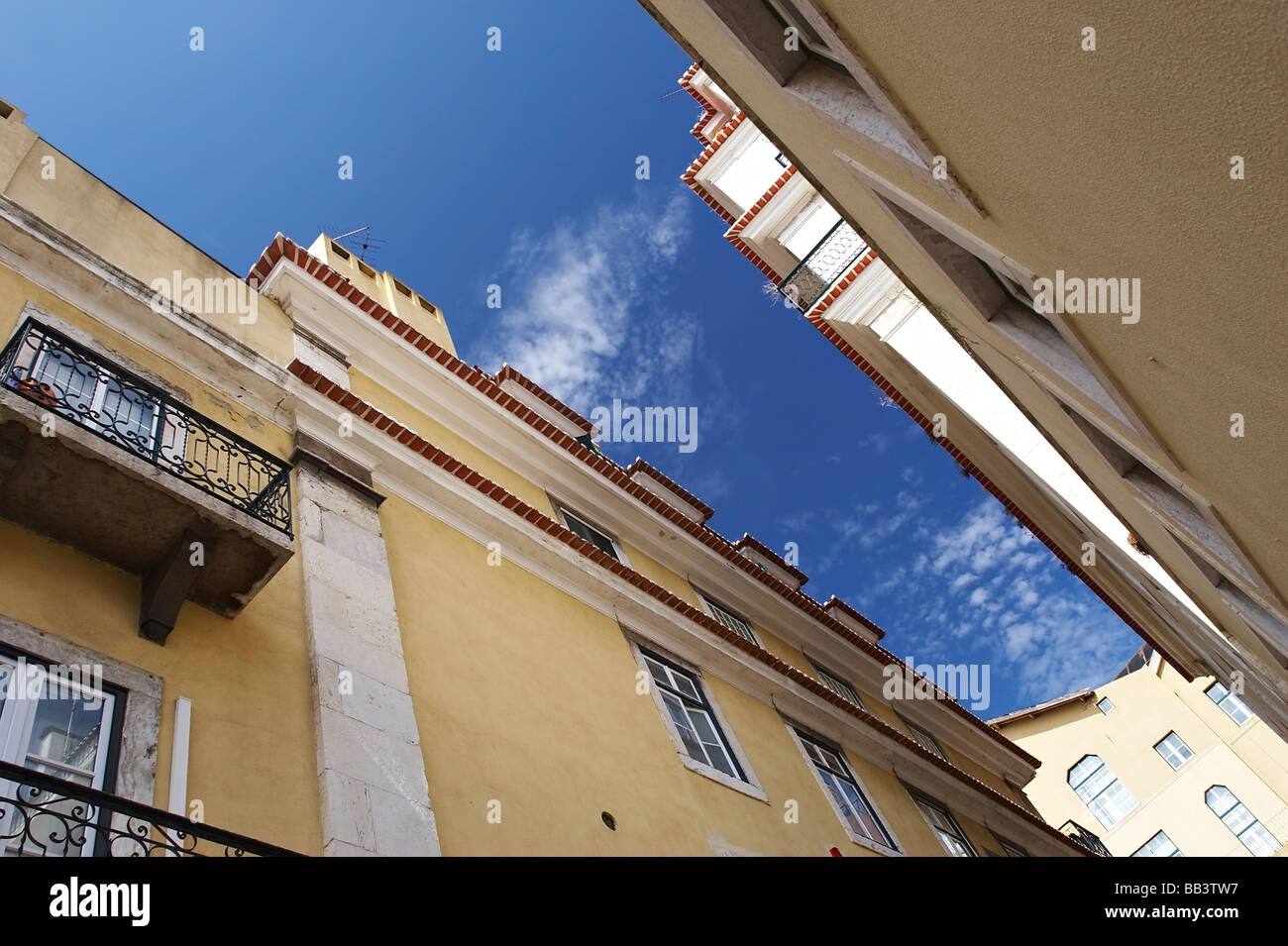 blue sky above narrow street of old town Stock Photo - Alamy