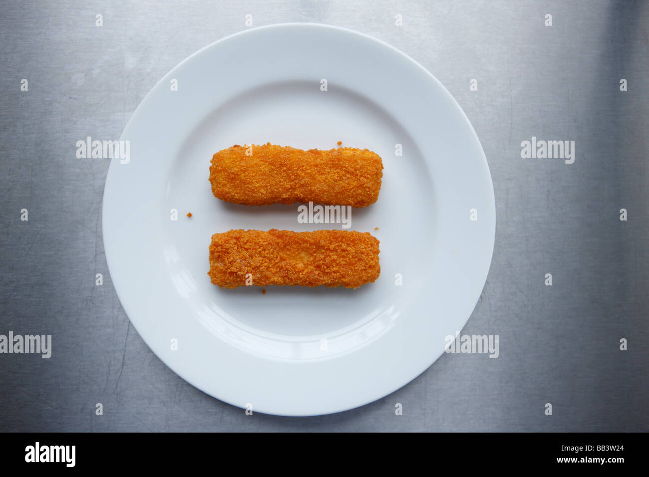 Fish fingers on plate, elevated view Stock Photo - Alamy