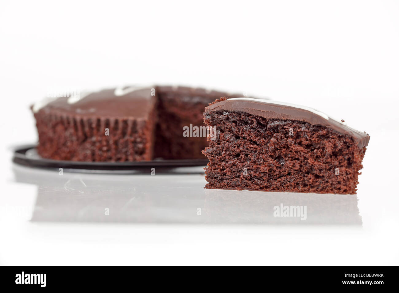 Slice of rich chocolate mud cake Stock Photo - Alamy