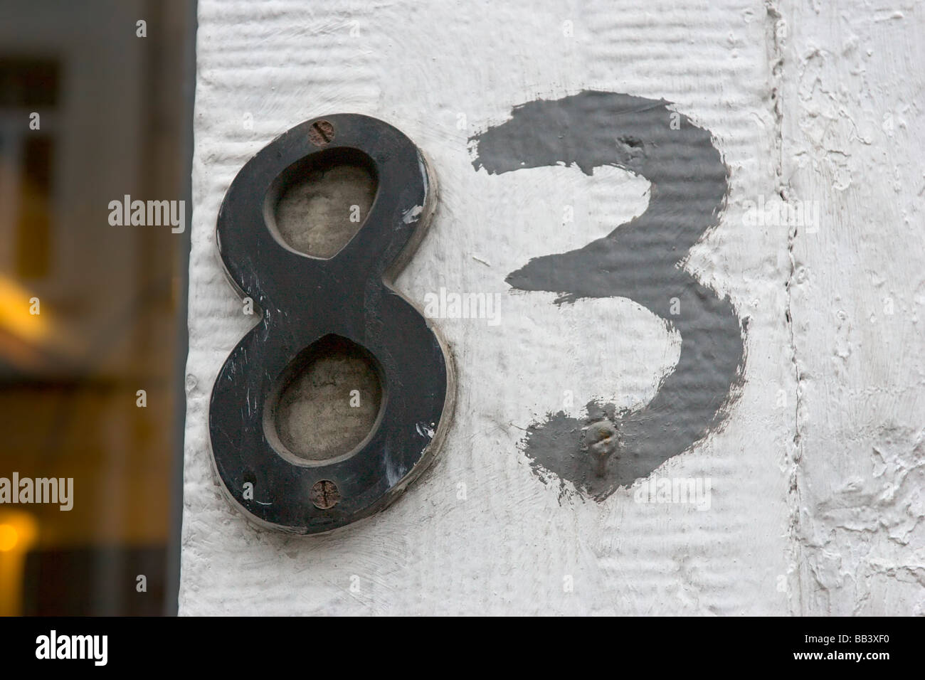 numbers 83 on wall of house Stock Photo - Alamy