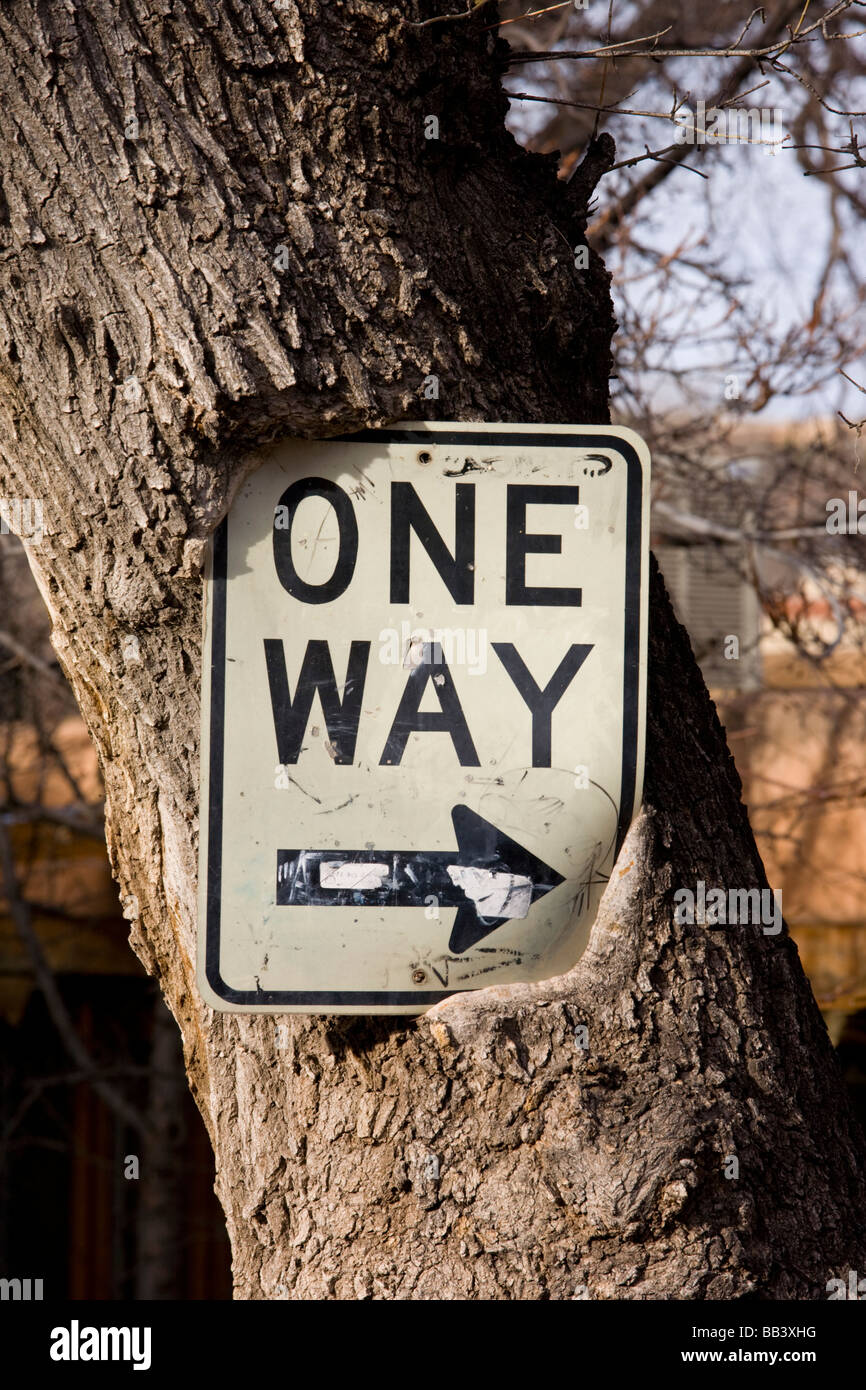 NA, USA, New Mexico, Santa Fe, One Way Sign attached to old tree (RF ...