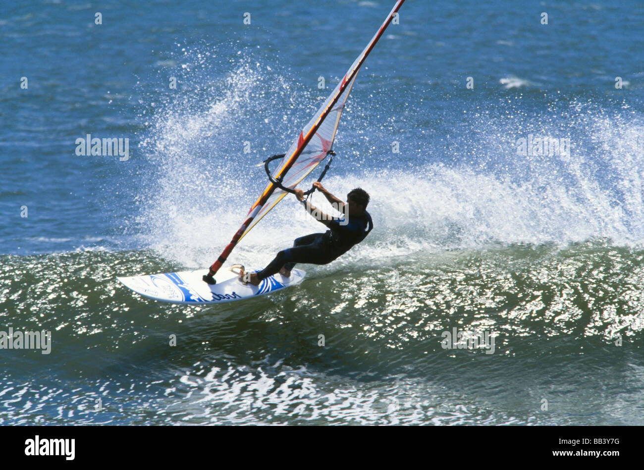 Windsurfer riding waves, Baja California, Mexico Stock Photo - Alamy