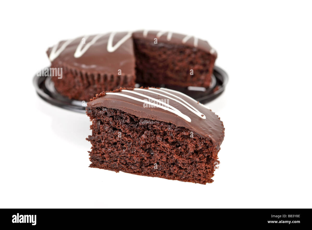 Slice of rich chocolate mud cake Stock Photo - Alamy