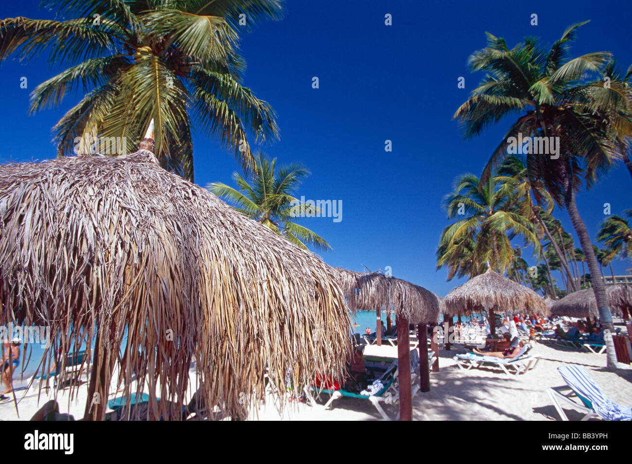 Beach Scene with Palapas Eagle Beach Aruba Stock Photo - Alamy