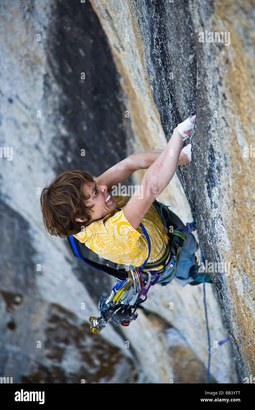 Female climber hand jambing her way up a steep crack Stock Photo - Alamy