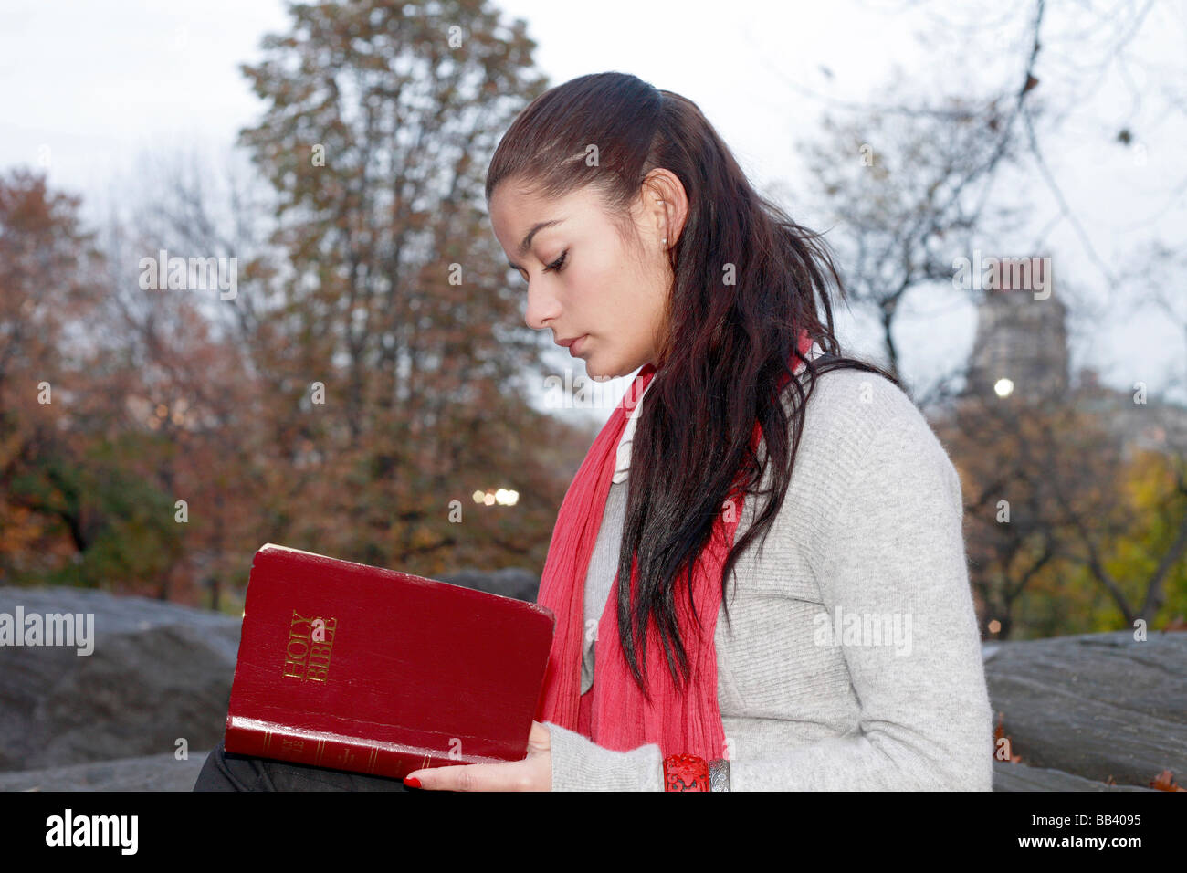 Girl reading Bible Stock Photo - Alamy