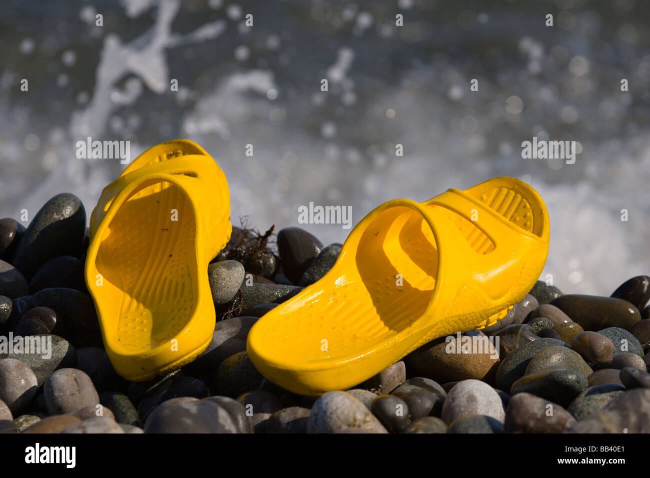 yellow rubber slippers Stock Photo - Alamy