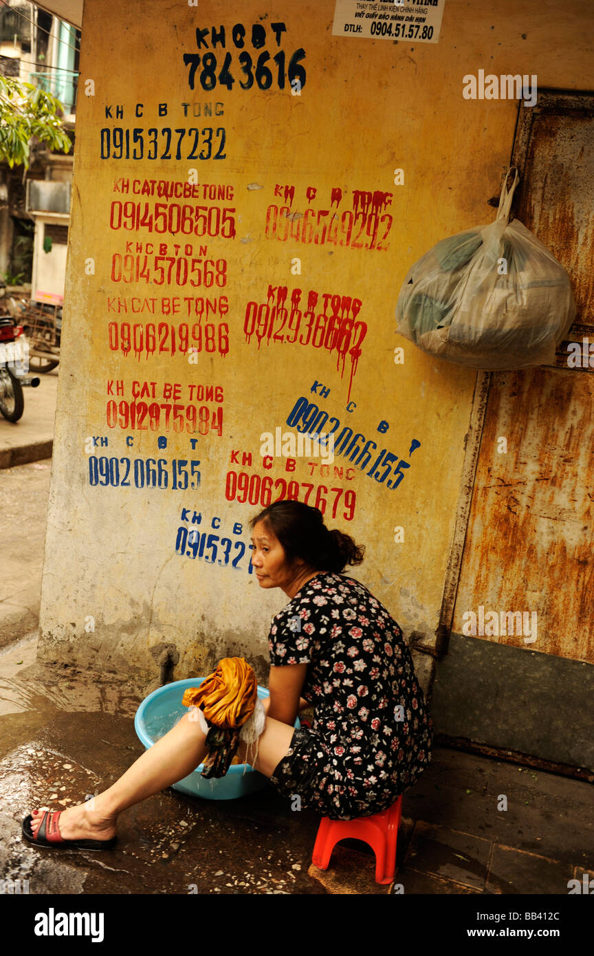Lady washing clothes hi-res stock photography and images - Alamy