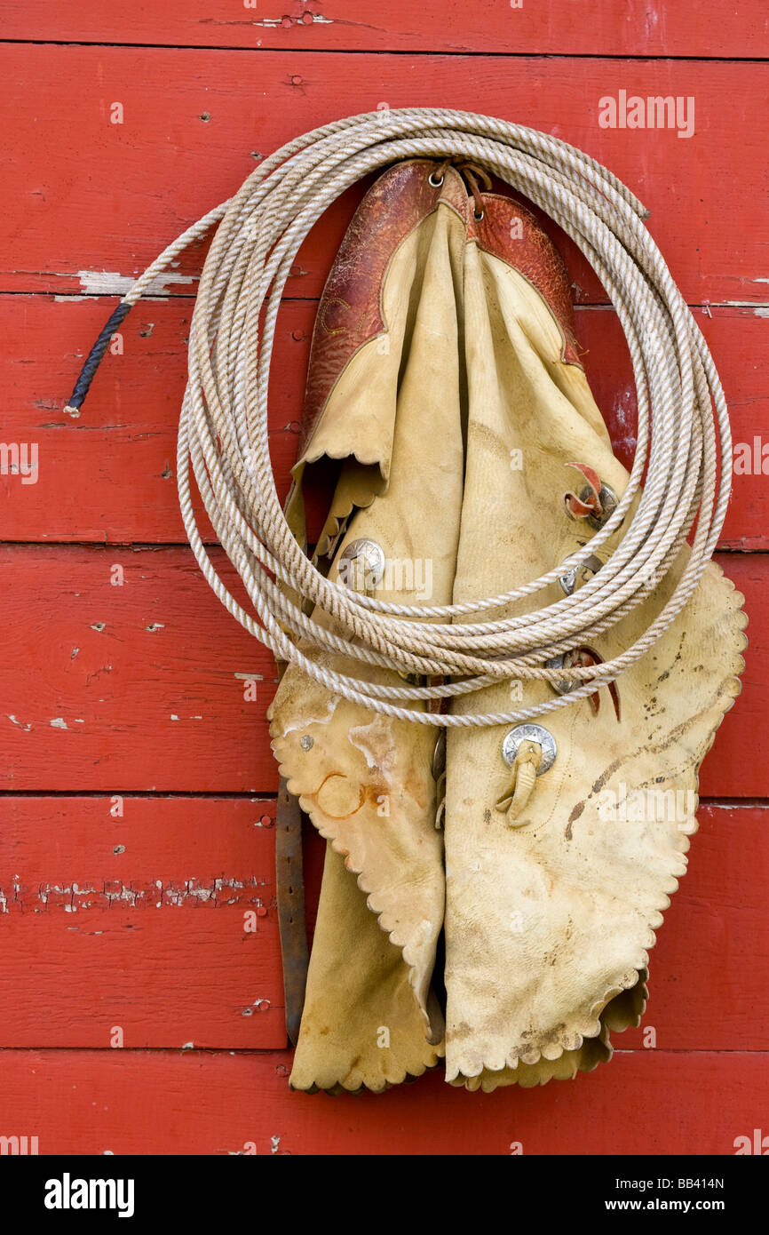 USA, Oregon, Seneca, Ponderosa Ranch. Leather chaps and rope hanging on ...