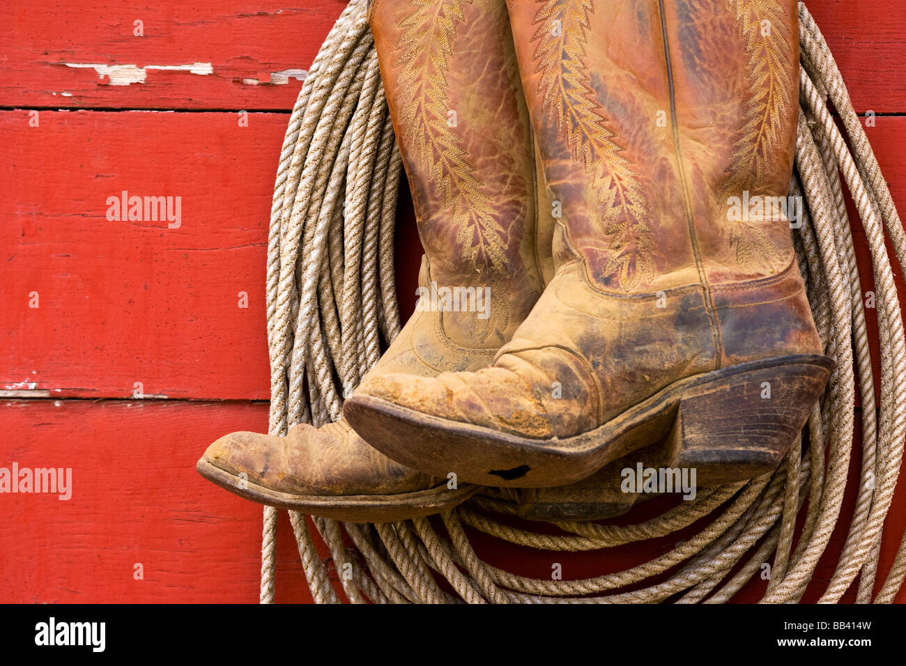 USA, Oregon, Seneca, Ponderosa Ranch. Close-up of cowboy boots and rope ...