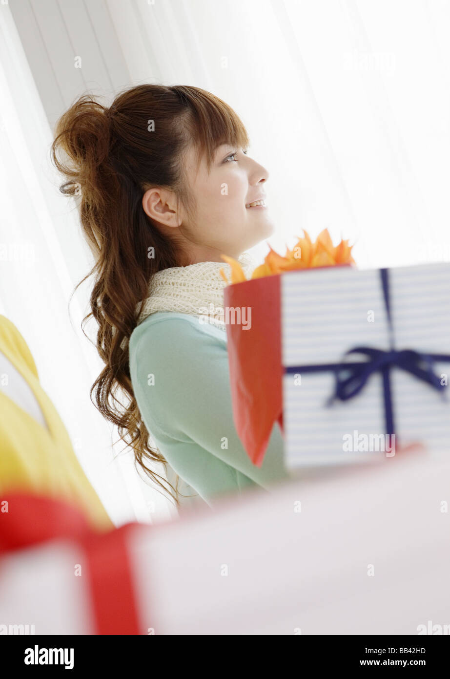 Woman and a present Stock Photo - Alamy