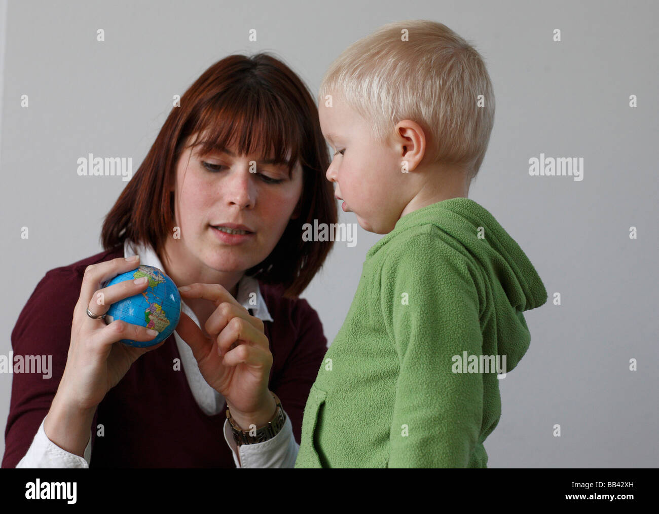 Mother explaining the world to her son Stock Photo - Alamy