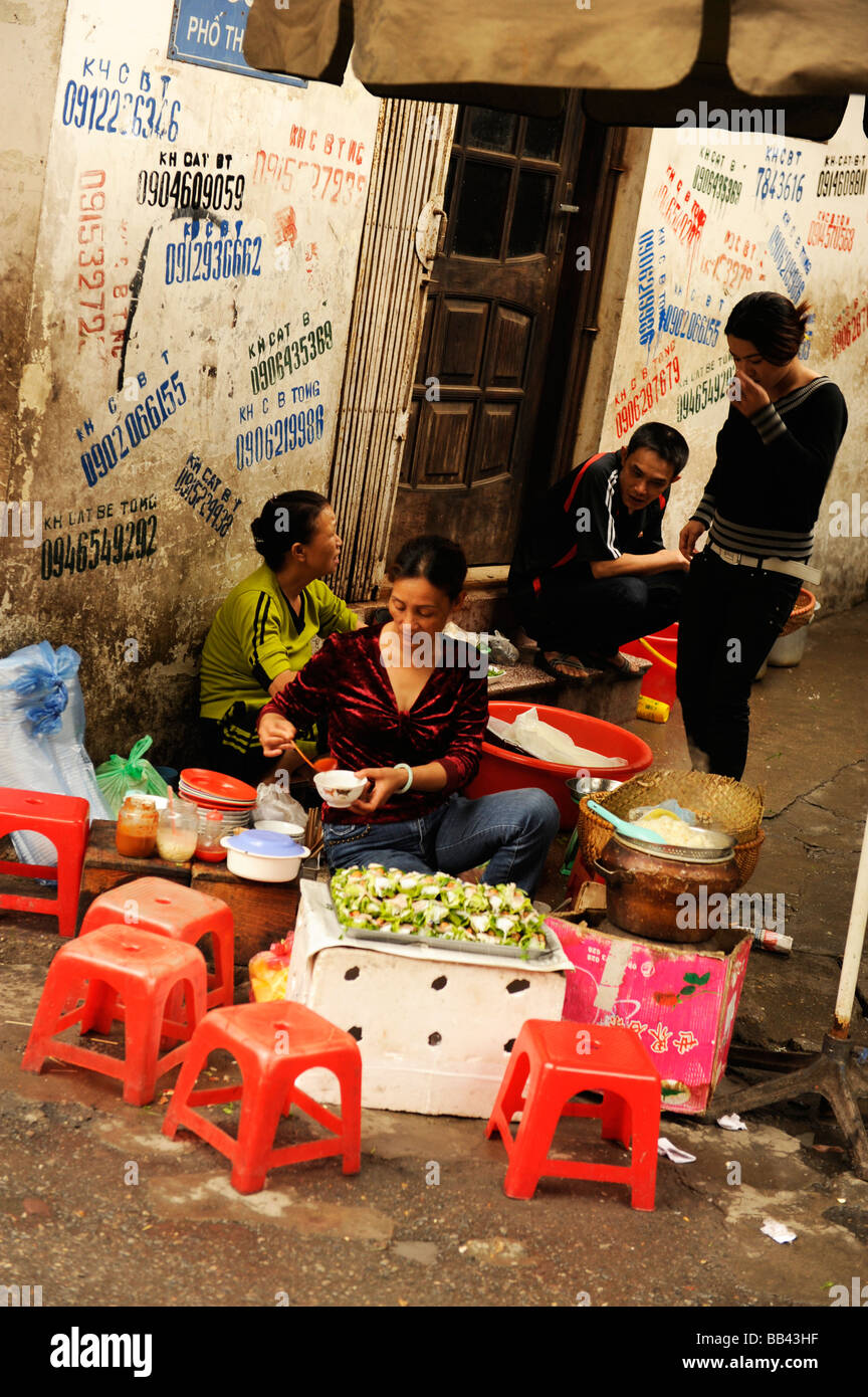food shop along with small plastic chairs for sirrting down and eat ...