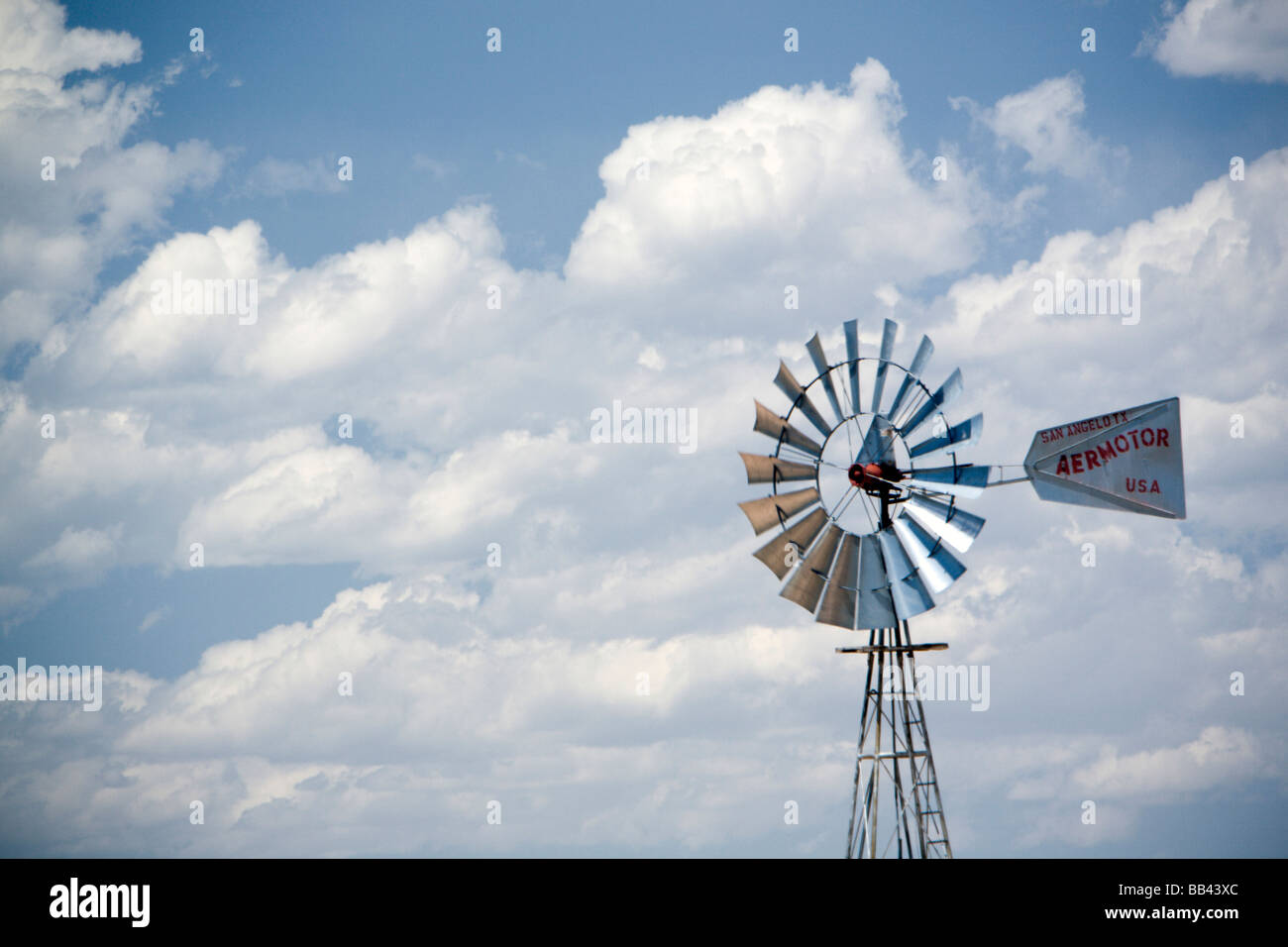 Desert windmill, water tank and horses on land near Hovemweep National ...