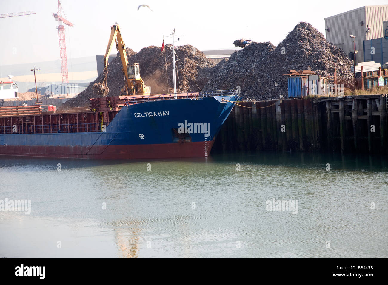 Scrap metal being loaded onto a bulk carrier ship Newhaven, East Sussex ...