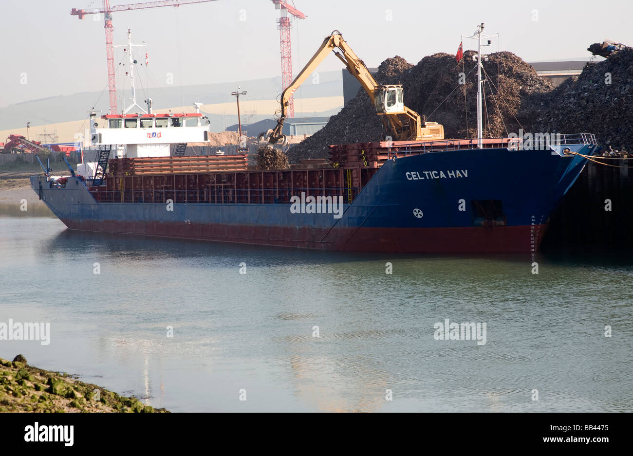 Scrap metal being loaded onto a bulk carrier ship Newhaven, East Sussex ...
