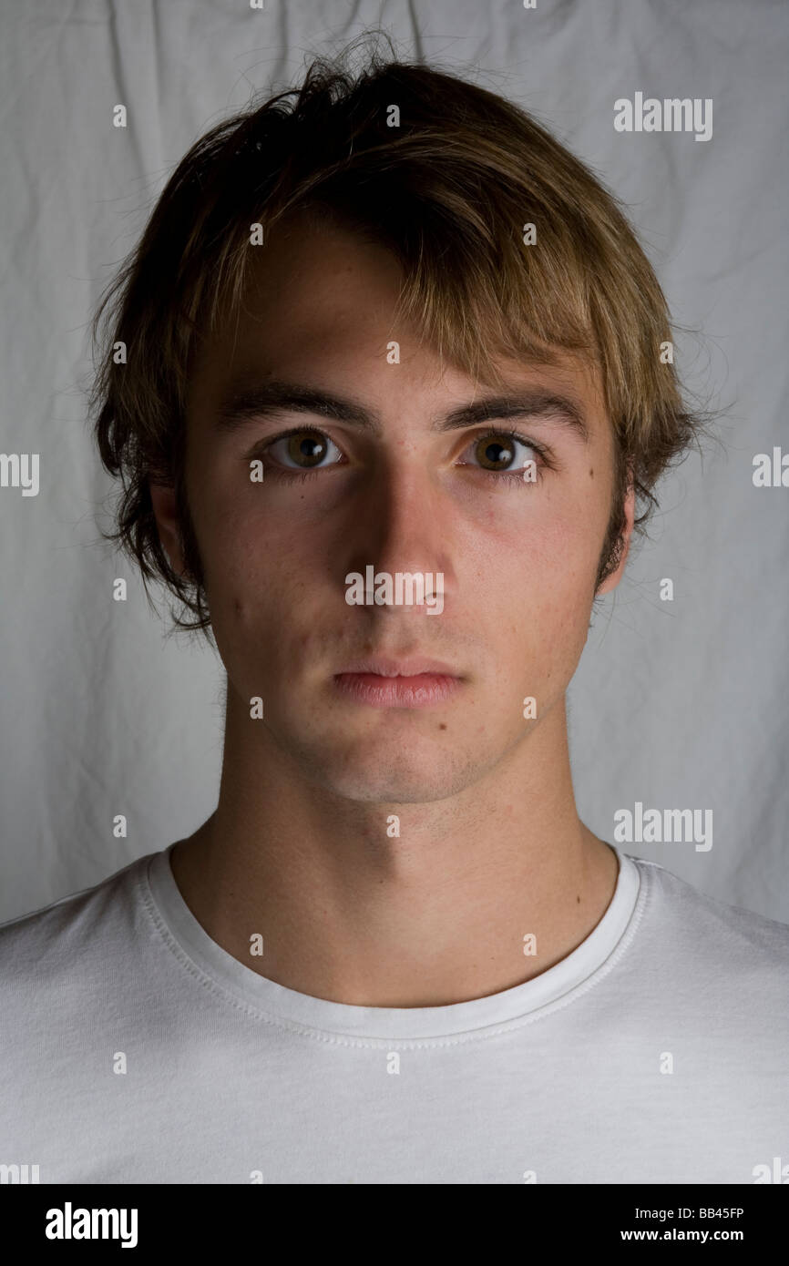 Adolescent boy poses for studio portrait, Maine Stock Photo - Alamy