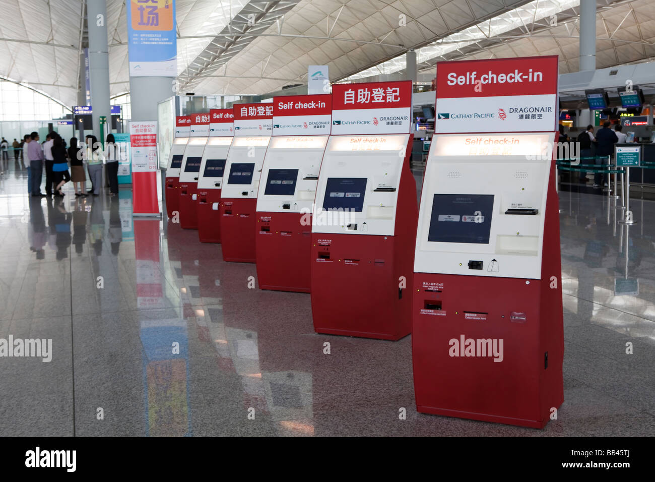 Self check-in machines are seen at the Hong Kong International Airport ...