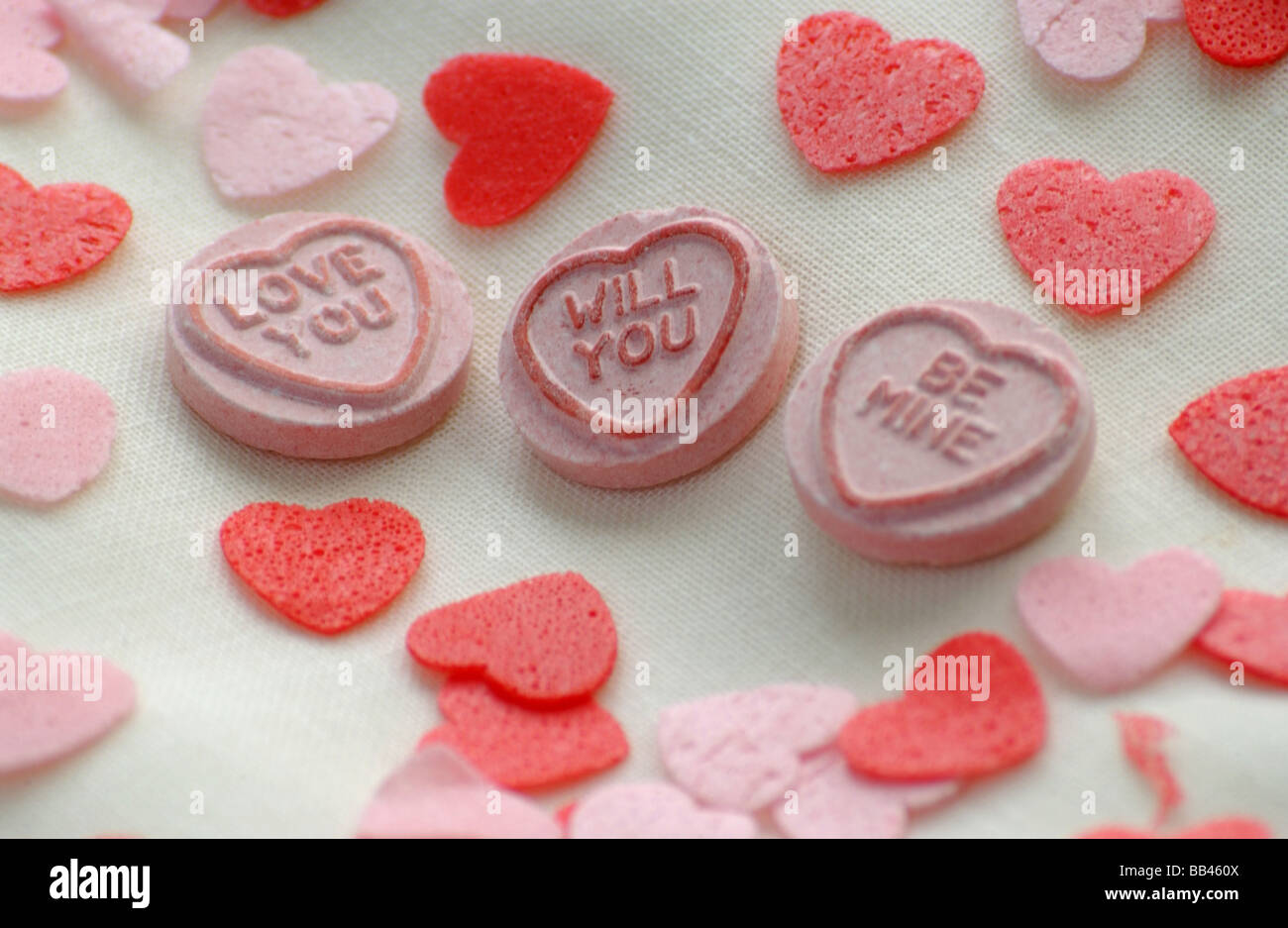 love heart sweets with different love messages Stock Photo - Alamy