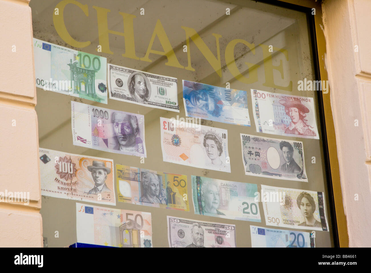 Various money on the window of a currency exchange business, Prague ...