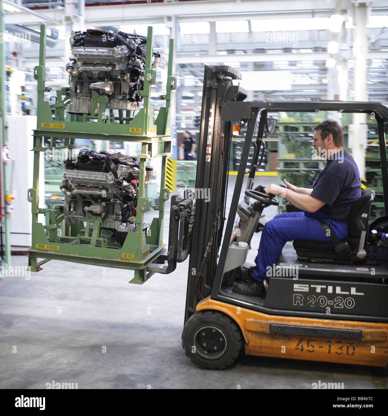 Employees with forklift truck at Mercedes Benz Stock Photo - Alamy