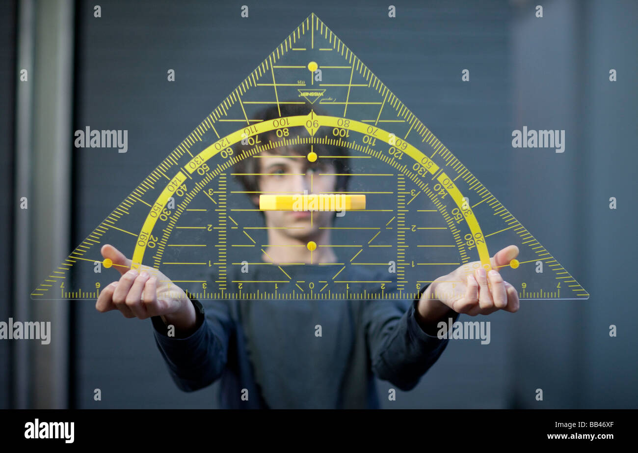 Student holding a big triangle Stock Photo - Alamy