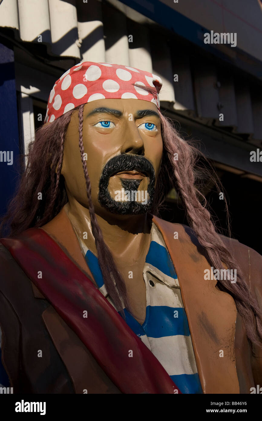 A wooden pirate with blue eyes in front of a souvenir shop in ...