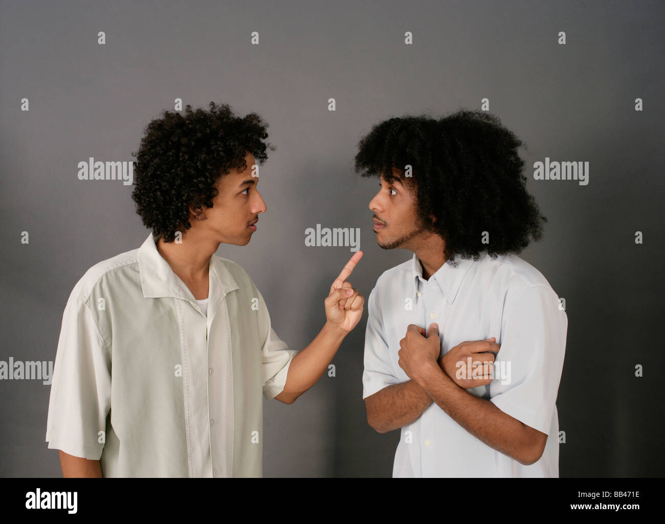 Two African American brothers play with each other Stock Photo - Alamy