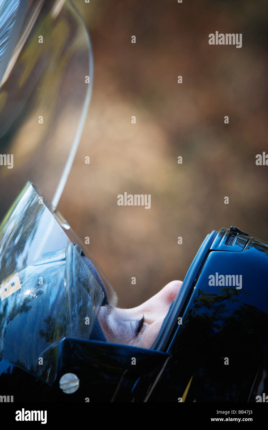 Side view a woman wearing a motorcycle helmet, California Stock Photo ...
