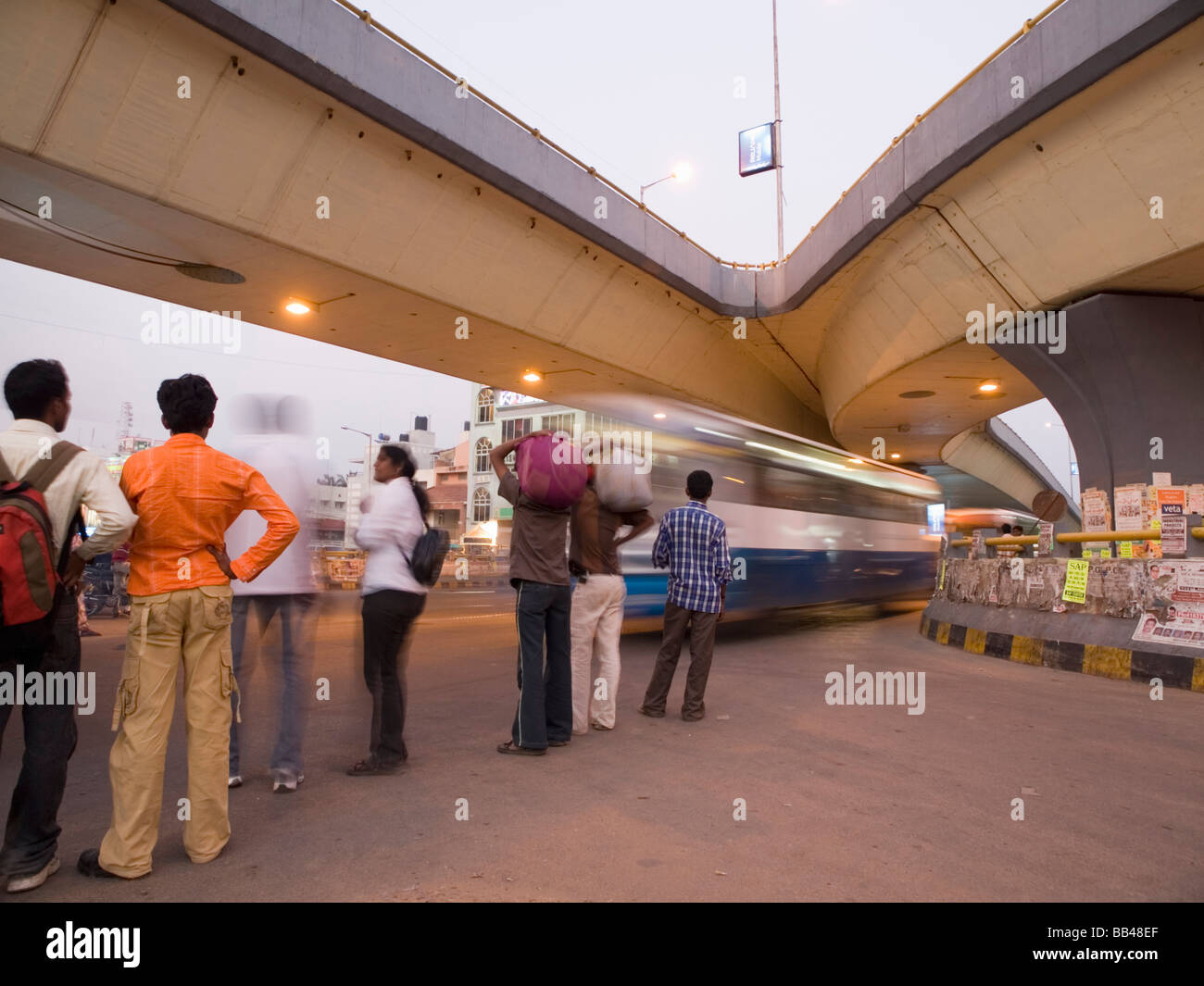 Traffic at twilight at an intersection of roads in Bangalore, Karnataka ...