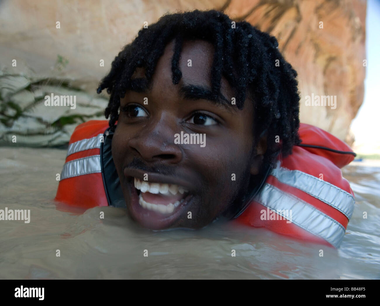 A boy floats down the Dolores River while on a rafting outing in ...