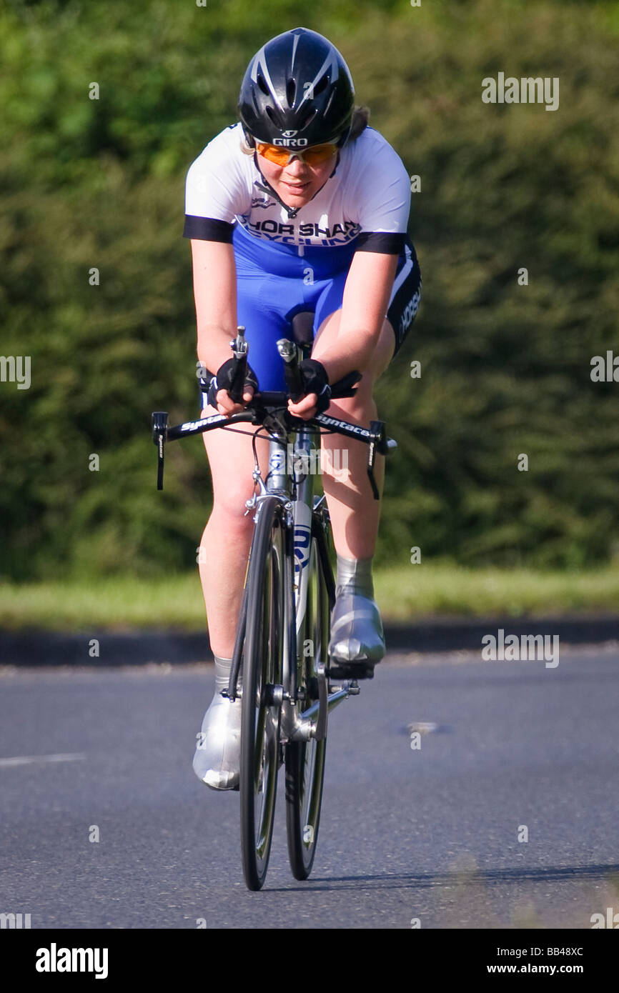 A female competing in a club time trial cycle race in West Sussex ...