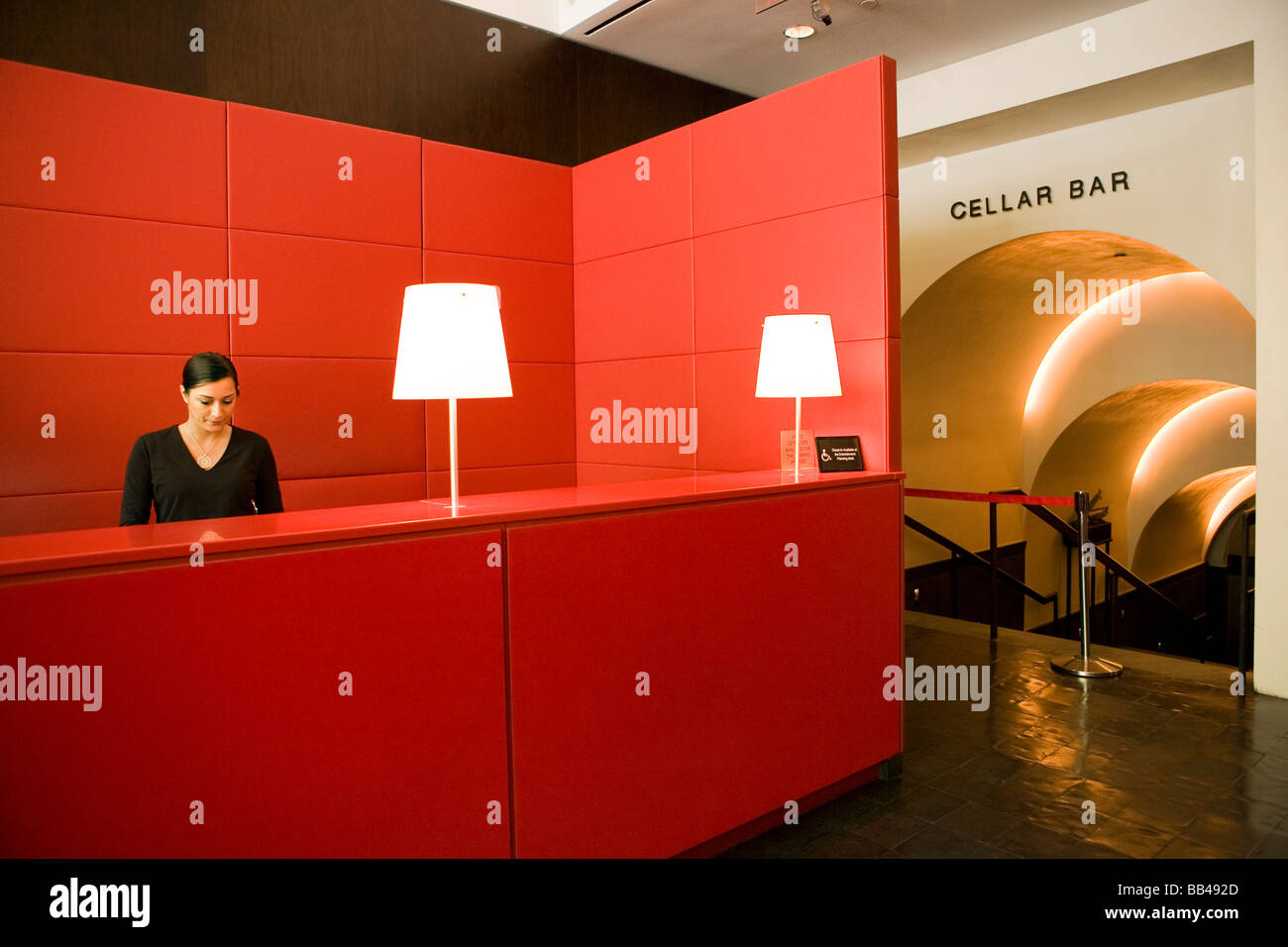 Female receptionist in a New York City hotel lobby Stock Photo - Alamy