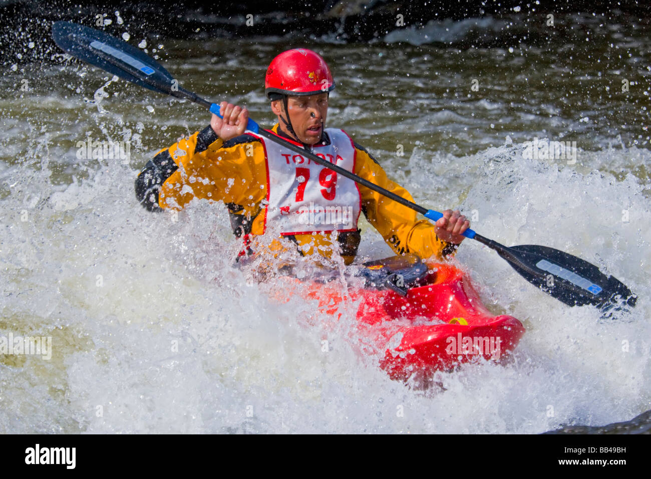 USA, Colorado, Frisco. Male competitor in Kayak Rodeo on Ten-Mile Creek ...