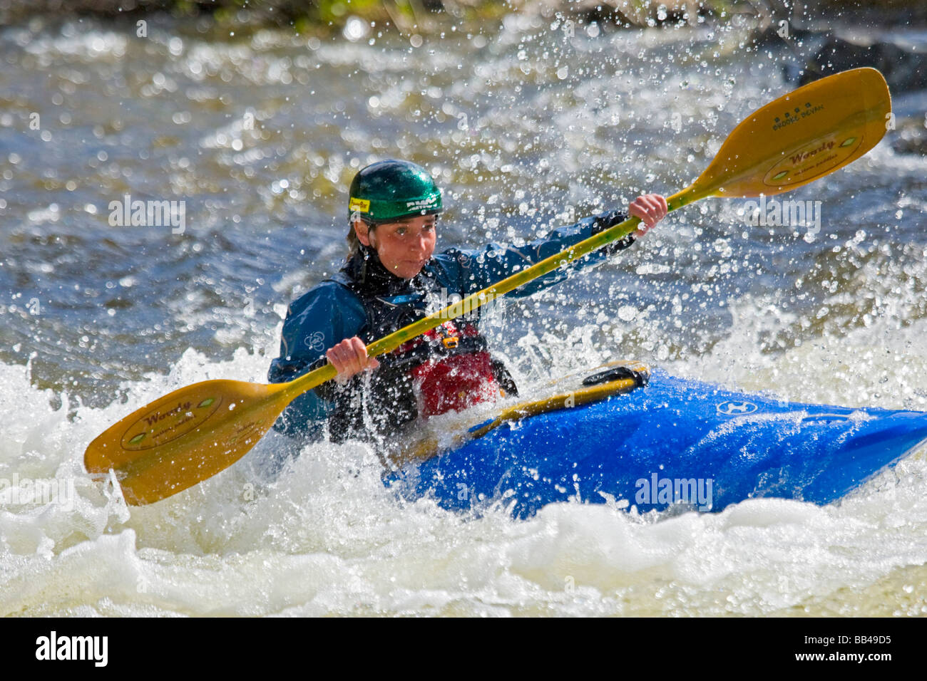 USA, Colorado, Frisco. Woman competitor in Kayak Rodeo on Ten-Mile ...