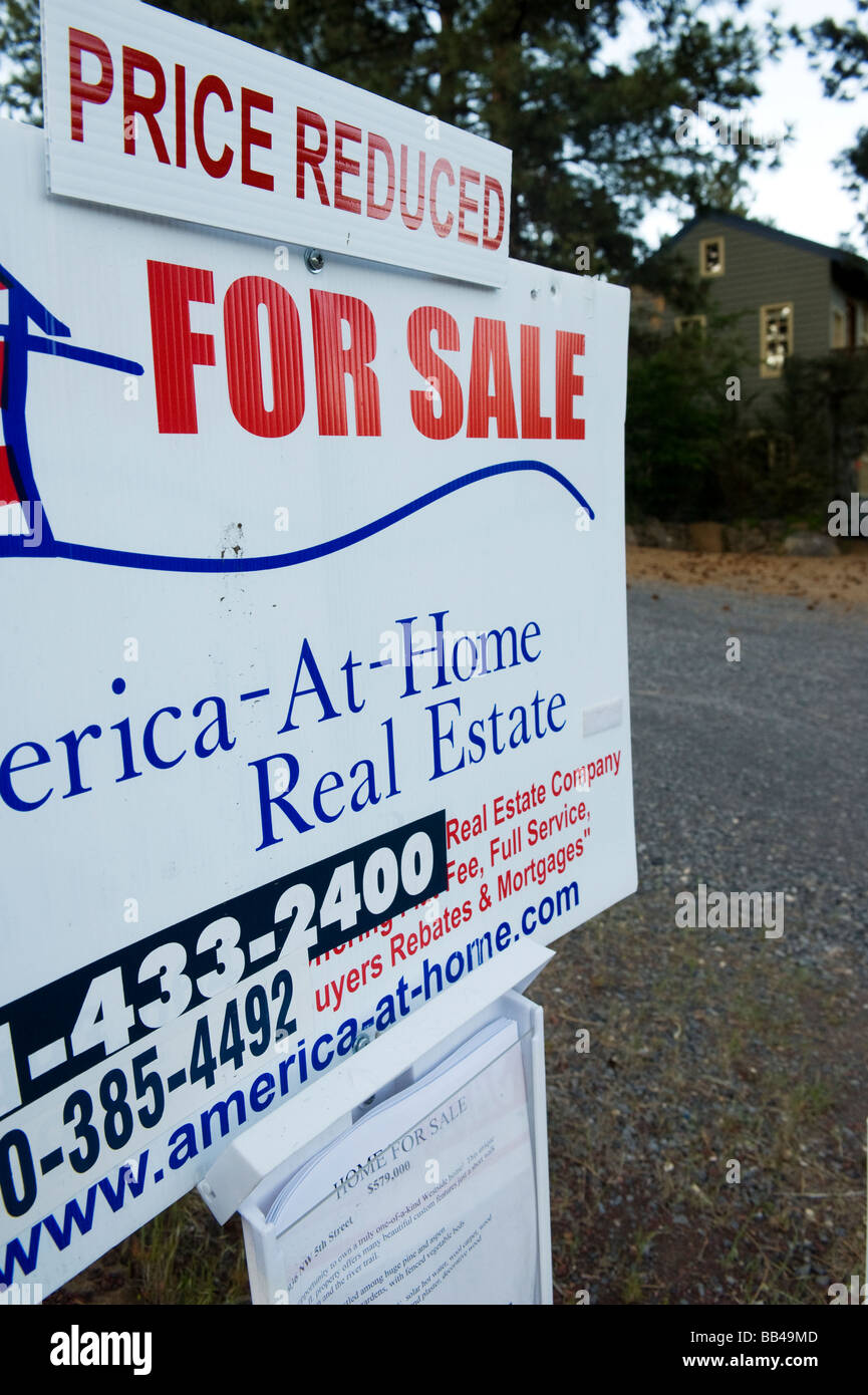 A 'price reduced' 'for sale' sign in front of a Bend, Oregon house ...