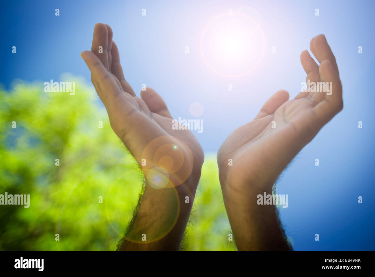 Two open hands reach out into the sky Stock Photo - Alamy