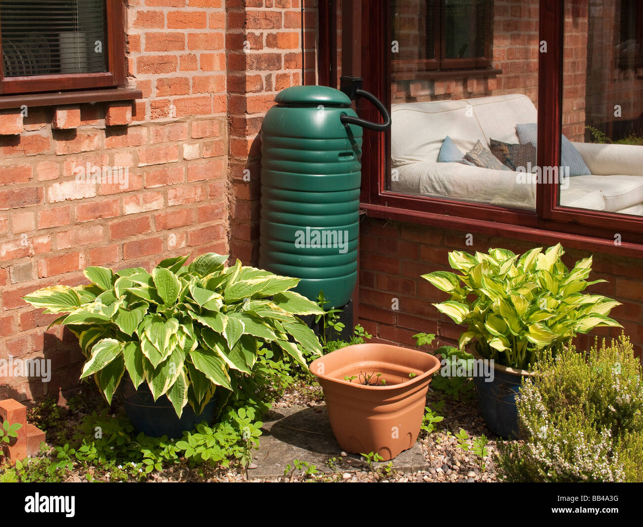 A water butt in a garden Stock Photo - Alamy