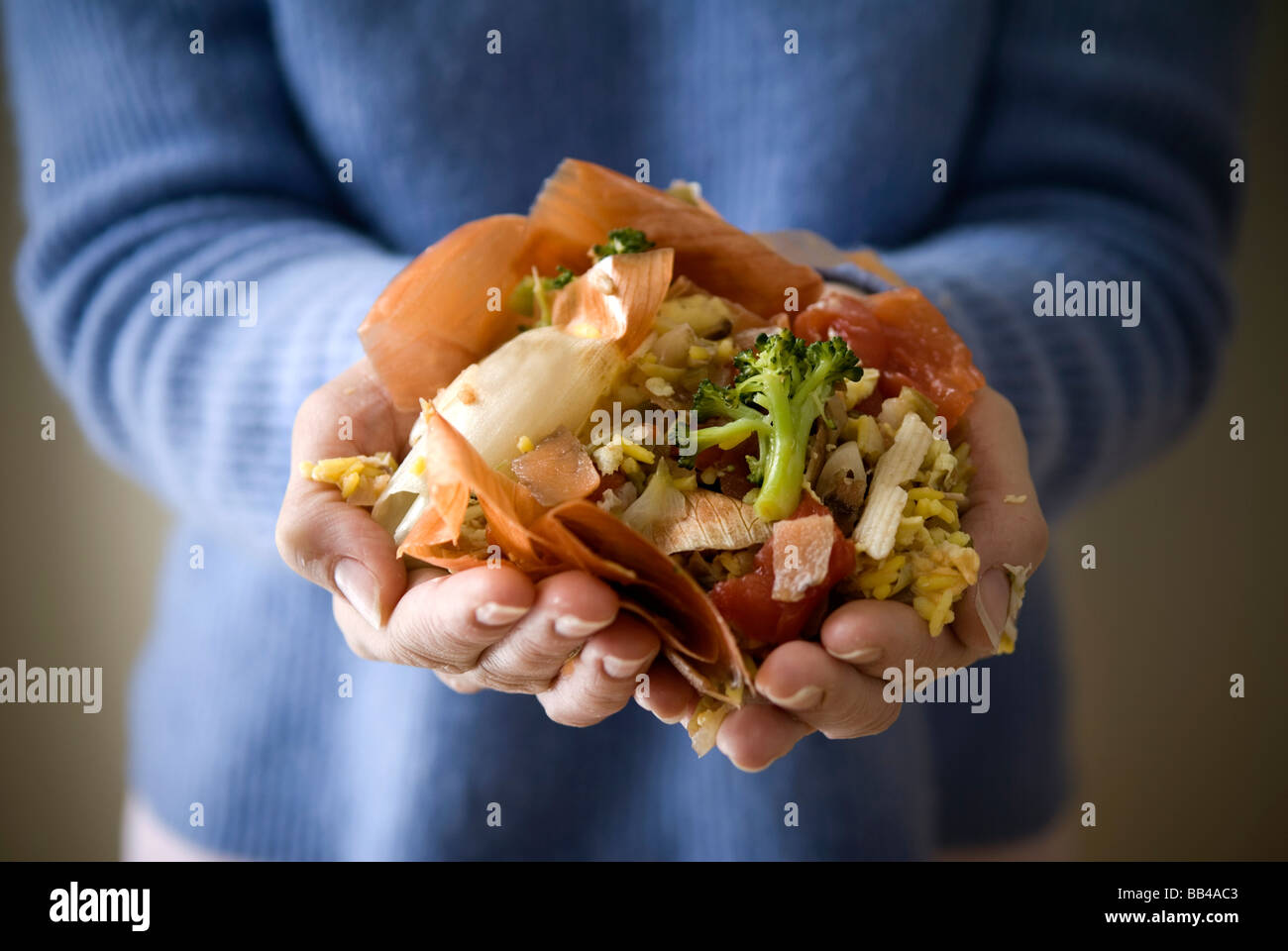 Hands holding discarded food for compost Stock Photo - Alamy