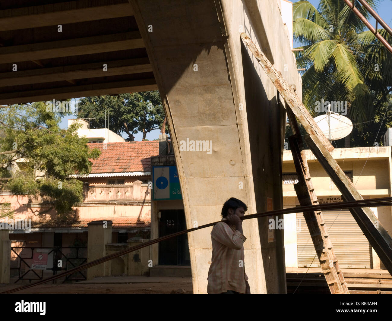 Older buildings contrast with new elevated highway under construction ...