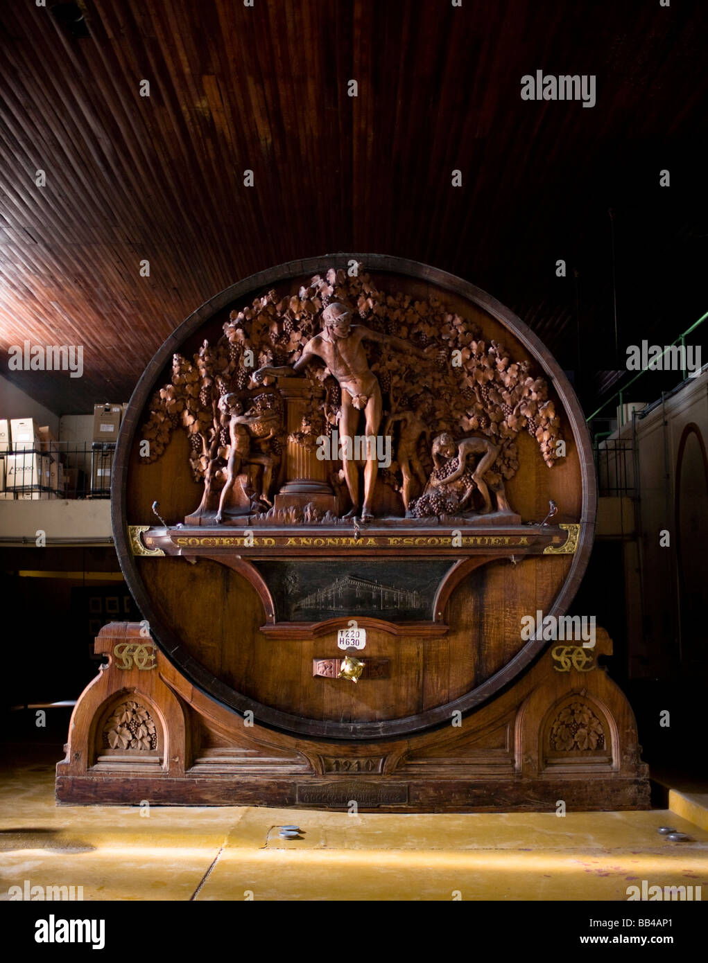 A large, hand-carved oak cask stands at a winery Stock Photo - Alamy